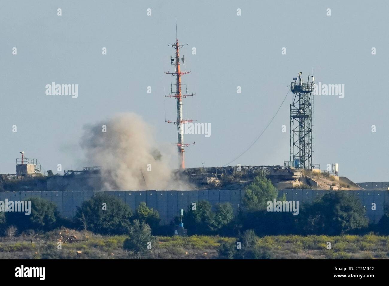 Smoke rises from inside an Israeli army position which was hit by ...