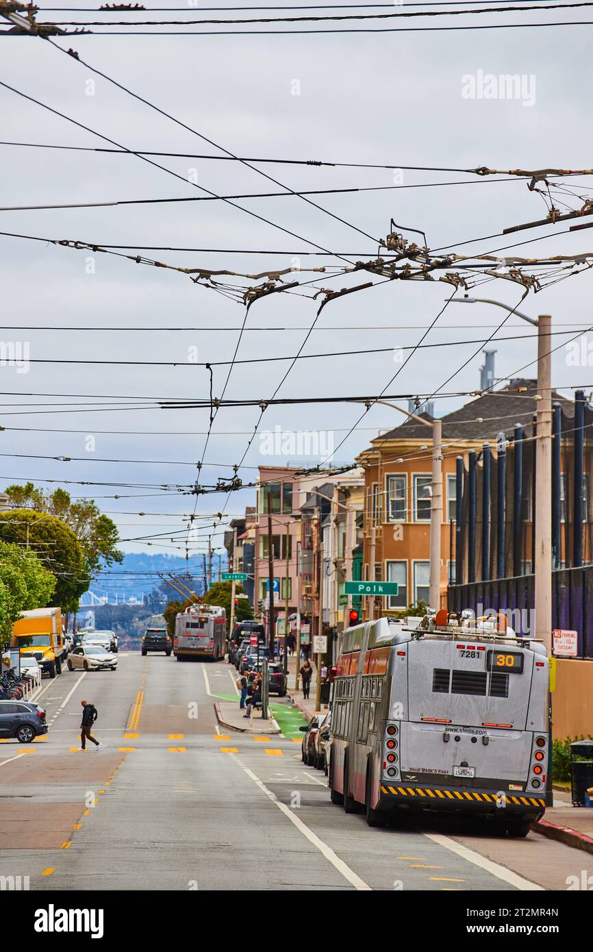 Clean Air Vehicle with second bus on hill street with cables over ...