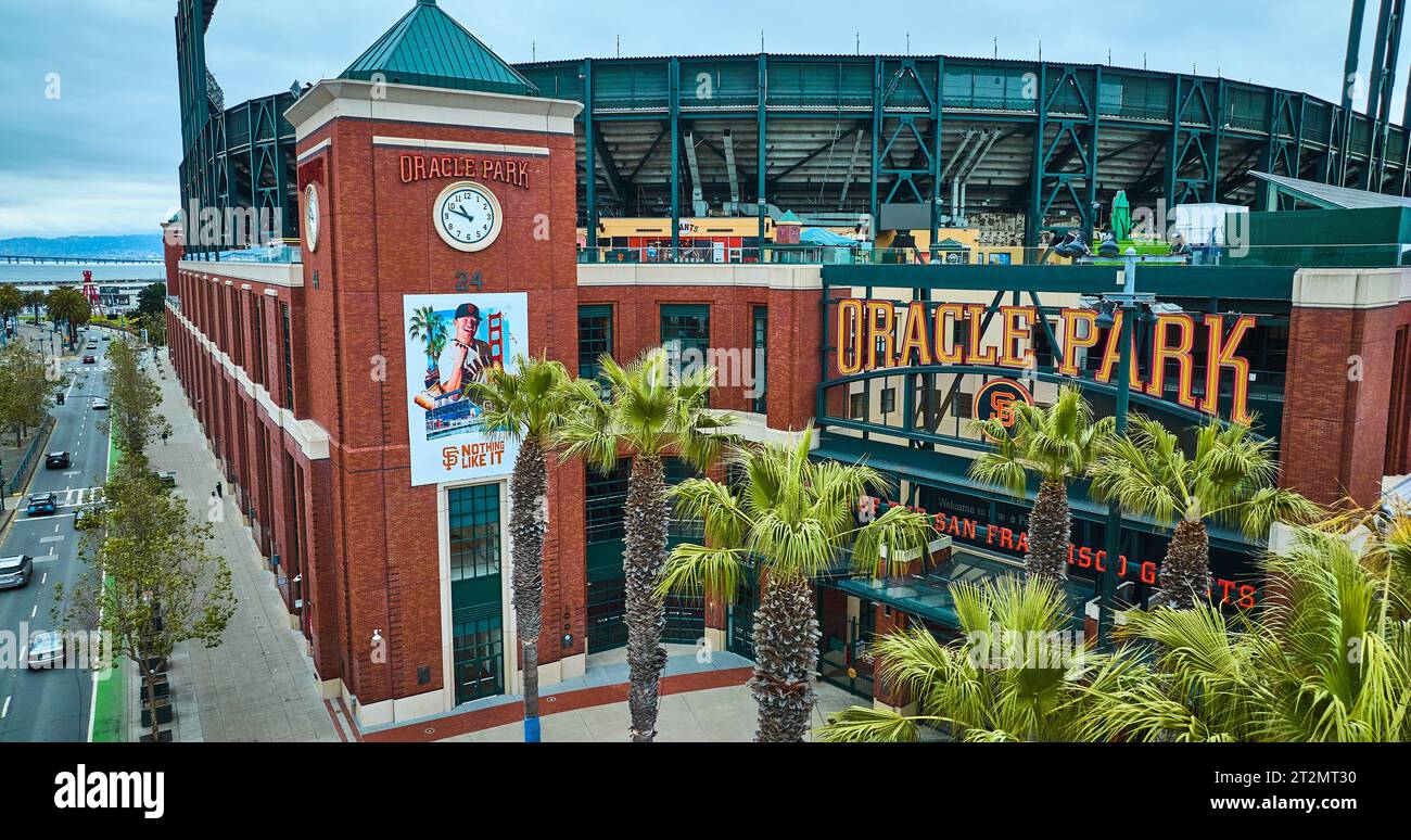 Oracle Park sign with clock aerial of ballpark from above palm trees ...