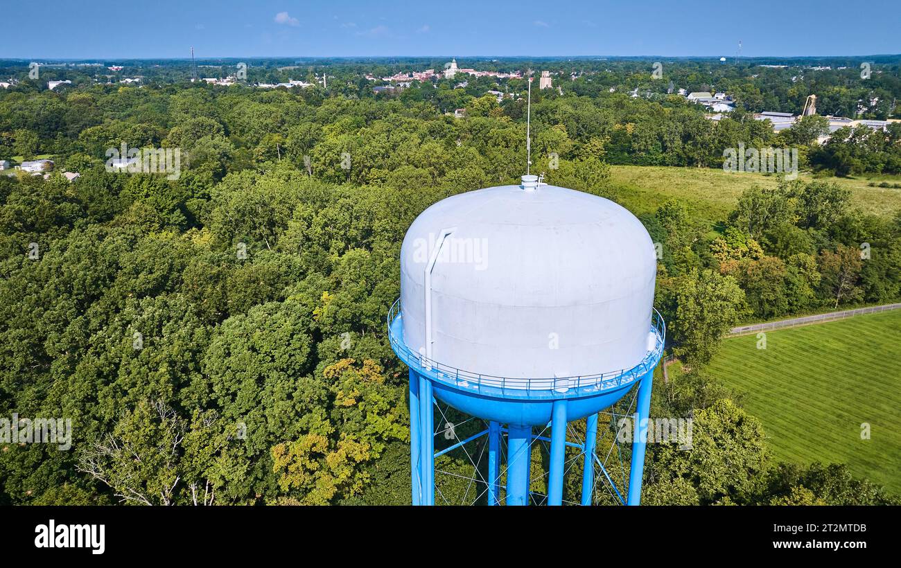 Generic backside of water tower close up with white top and blue base ...