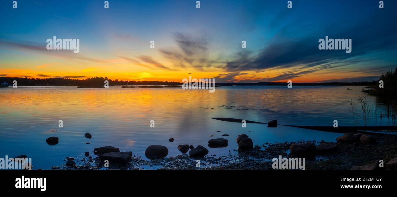 Magical sunset over clear lake Stock Photo - Alamy
