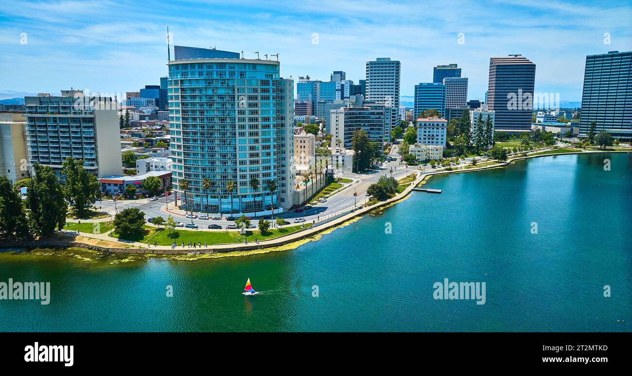 Lone sailboat on Lake Merritt in front of Eastshore Properties in ...