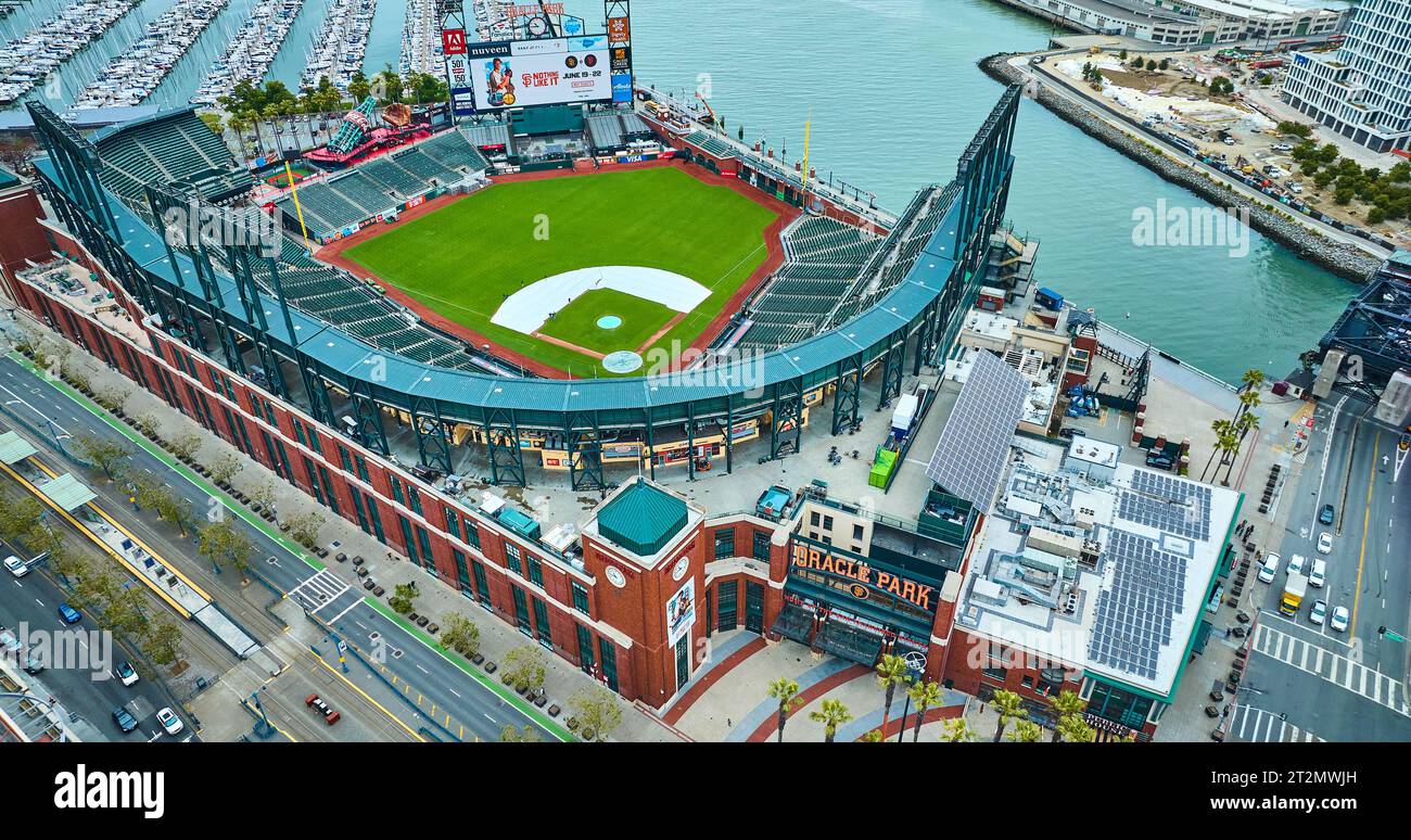 Oracle Park downward aerial of Willie Mays Gate entrance with people on ...