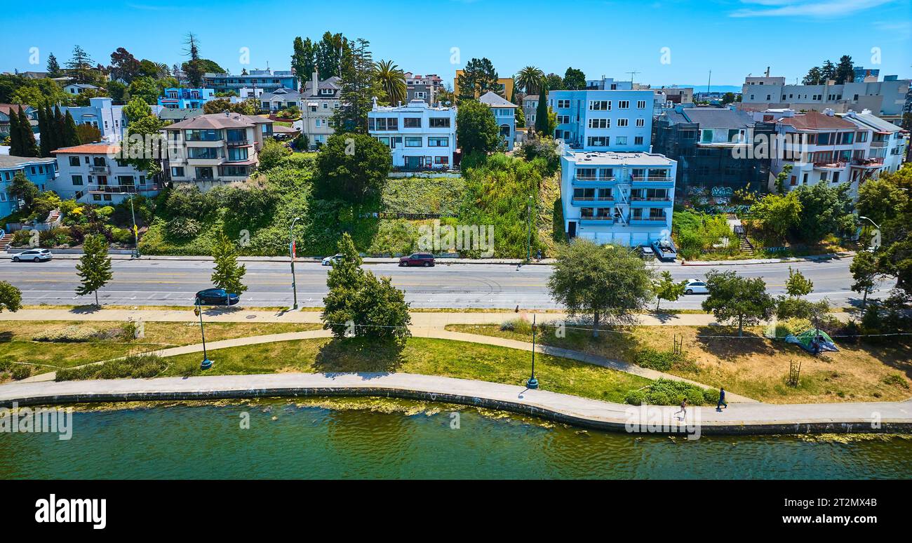 Lake Merritt shoreline with joggers on pathway around lake aerial of ...