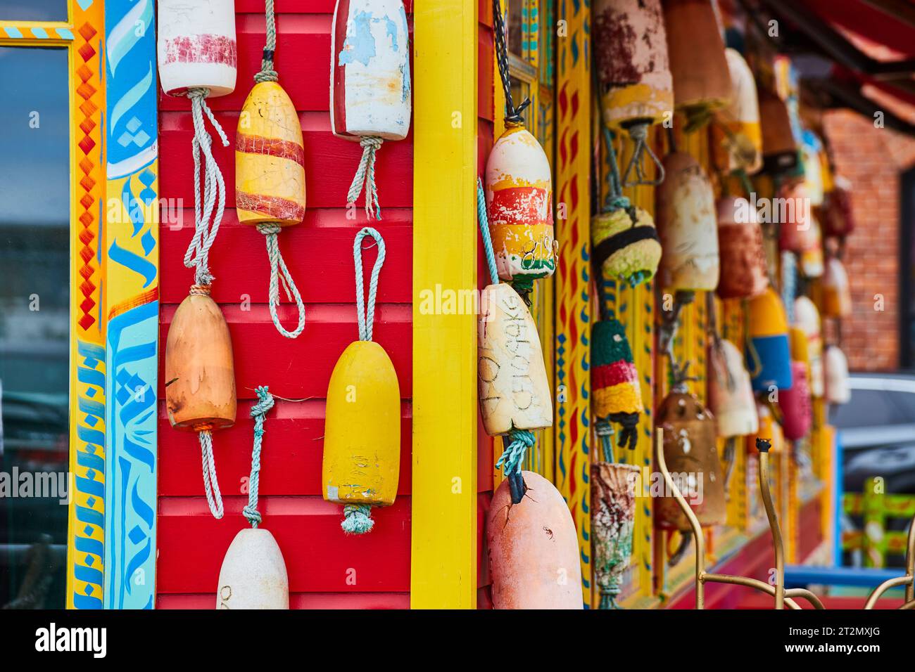 Variety of clay bells on wall with corner split and more on shop ...