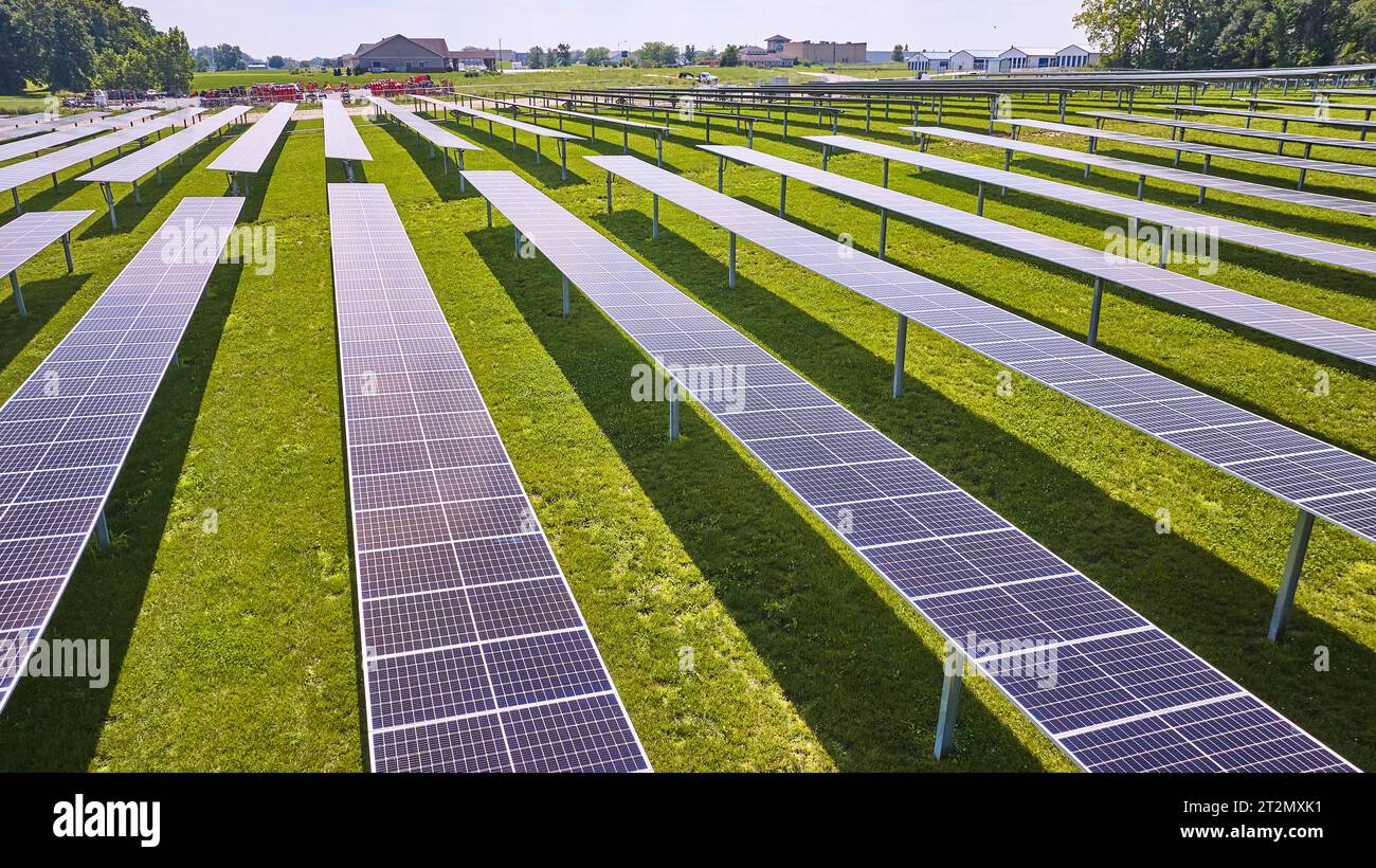 Sunlight hitting solar panels on solar farm in low flying aerial Stock ...