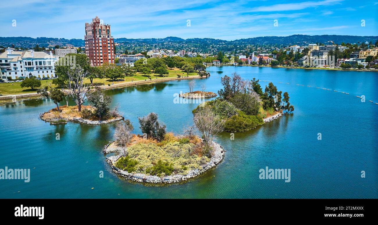 Pelican Island on Lake Merritt with low aerial of Oakland City ...