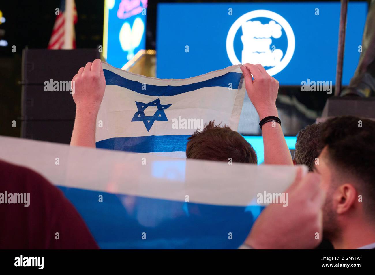 New York, New York, USA. 19th Oct, 2023. People hold up Israeli flags ...