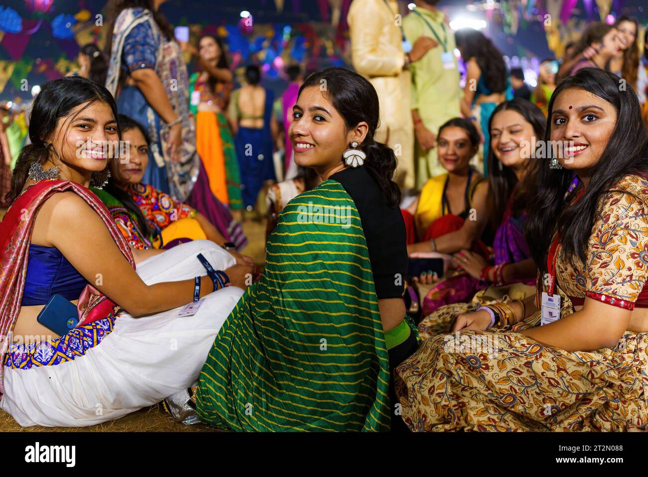 Young Indian women in traditional clothes are seen at the Navratri ...
