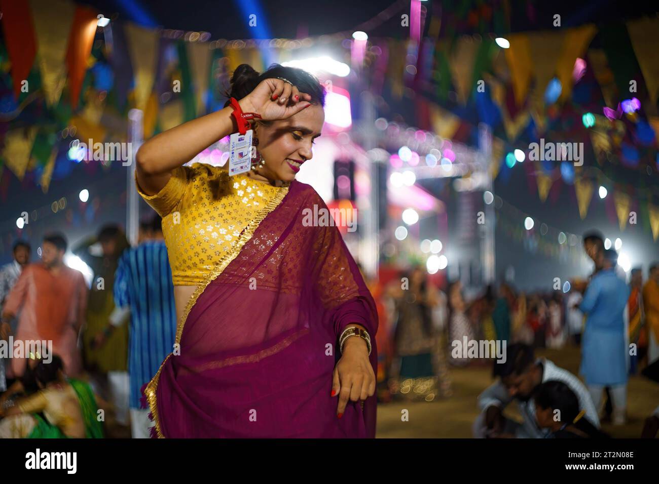 Young Indian women in traditional clothes are seen dancing the ...