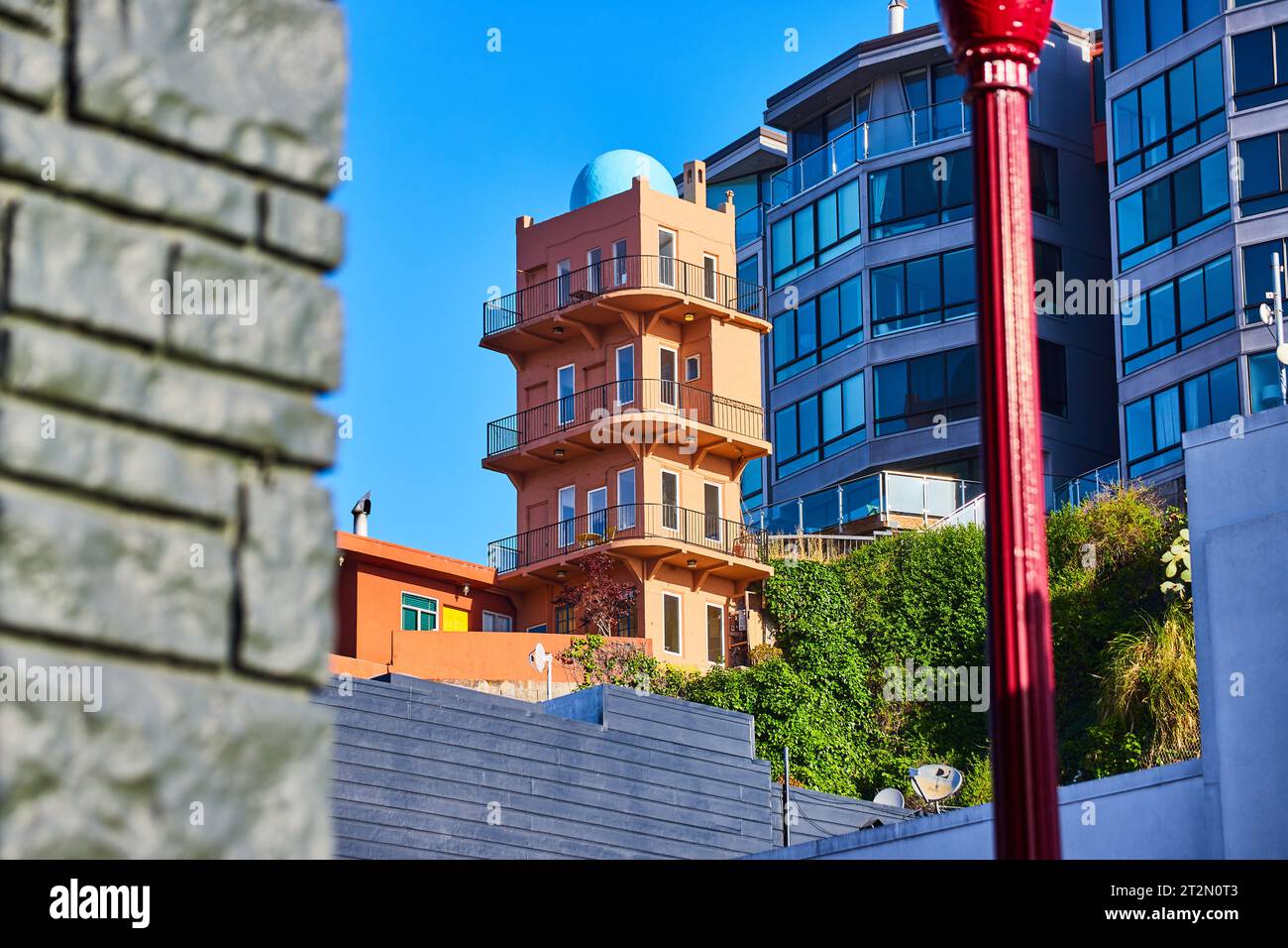Tall and unique orange building that forms shape of unique tower with ...