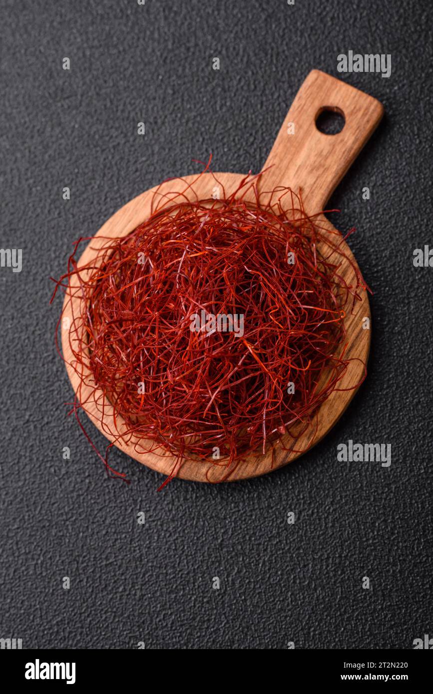 Red thin hot chili threads on a dark background. For decorating Asian ...
