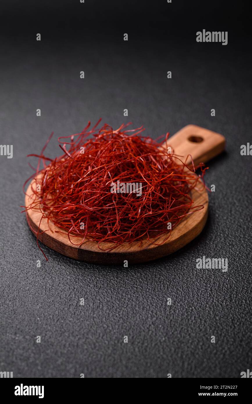 Red thin hot chili threads on a dark background. For decorating Asian ...