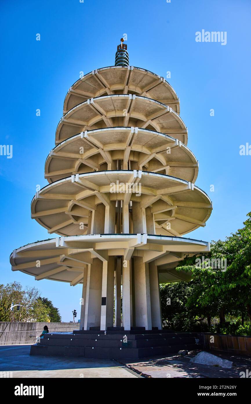 Underside of Peace Pagoda with person sitting on base of structure in ...