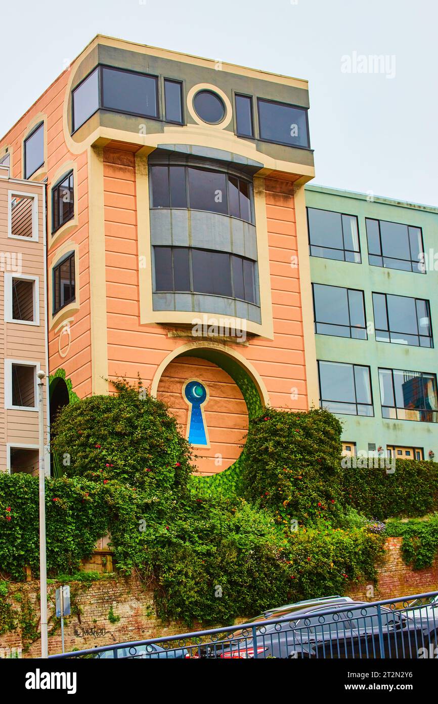 Creamsicle colored building with circular enclave with magical blue key ...