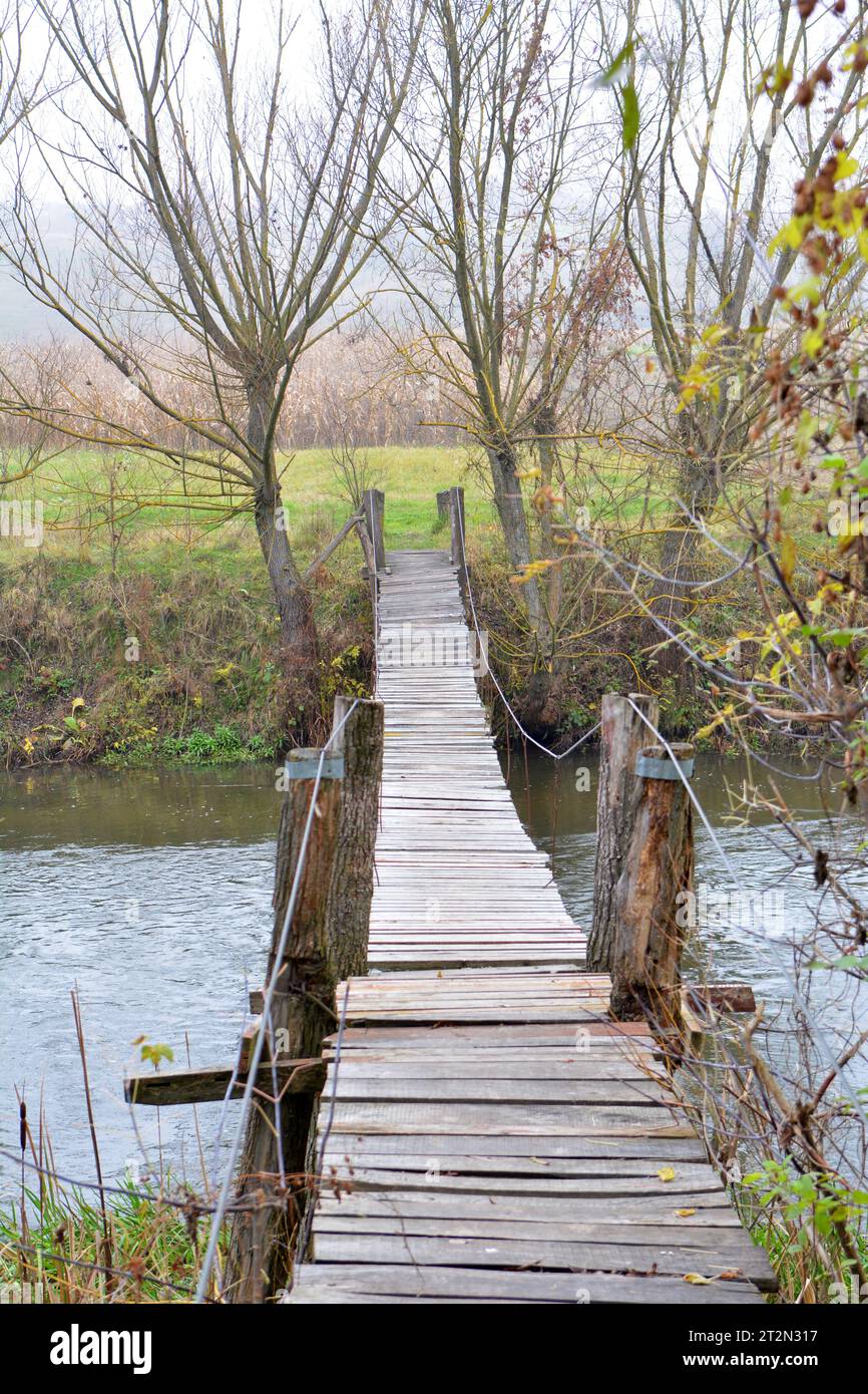 Wooden pedestrian bridge across river hi-res stock photography and ...