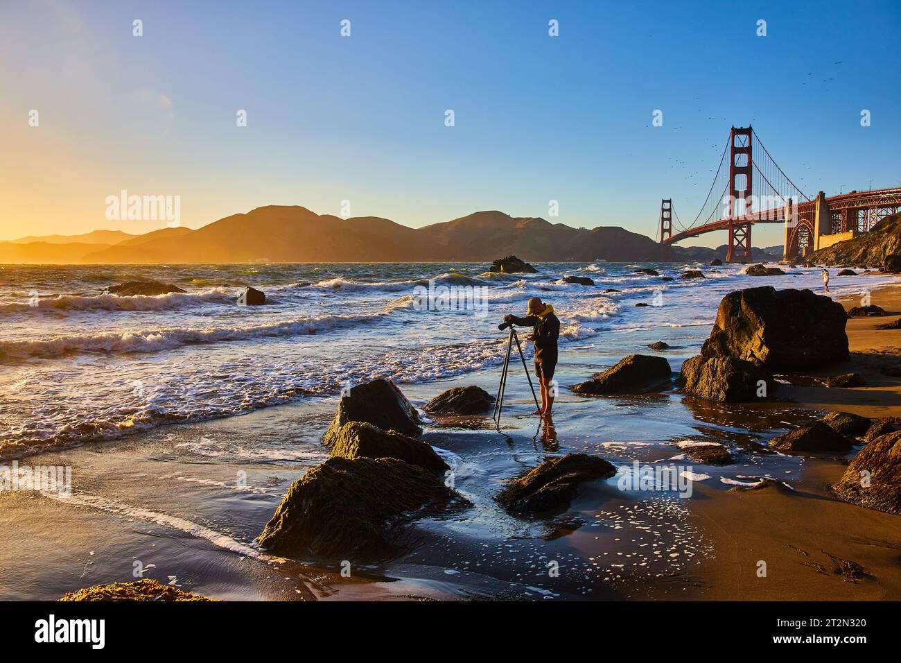 Photographer on Marshalls Beach capturing golden sunset with Golden ...