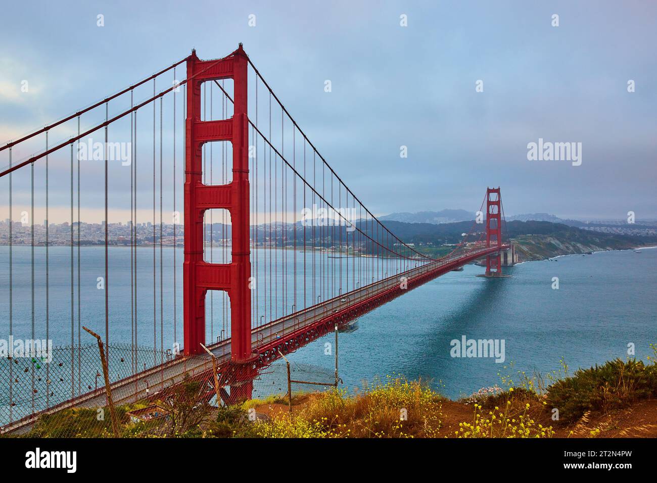 Cloudy and hazy sunset from Golden Gate Bridge overlook with view of ...