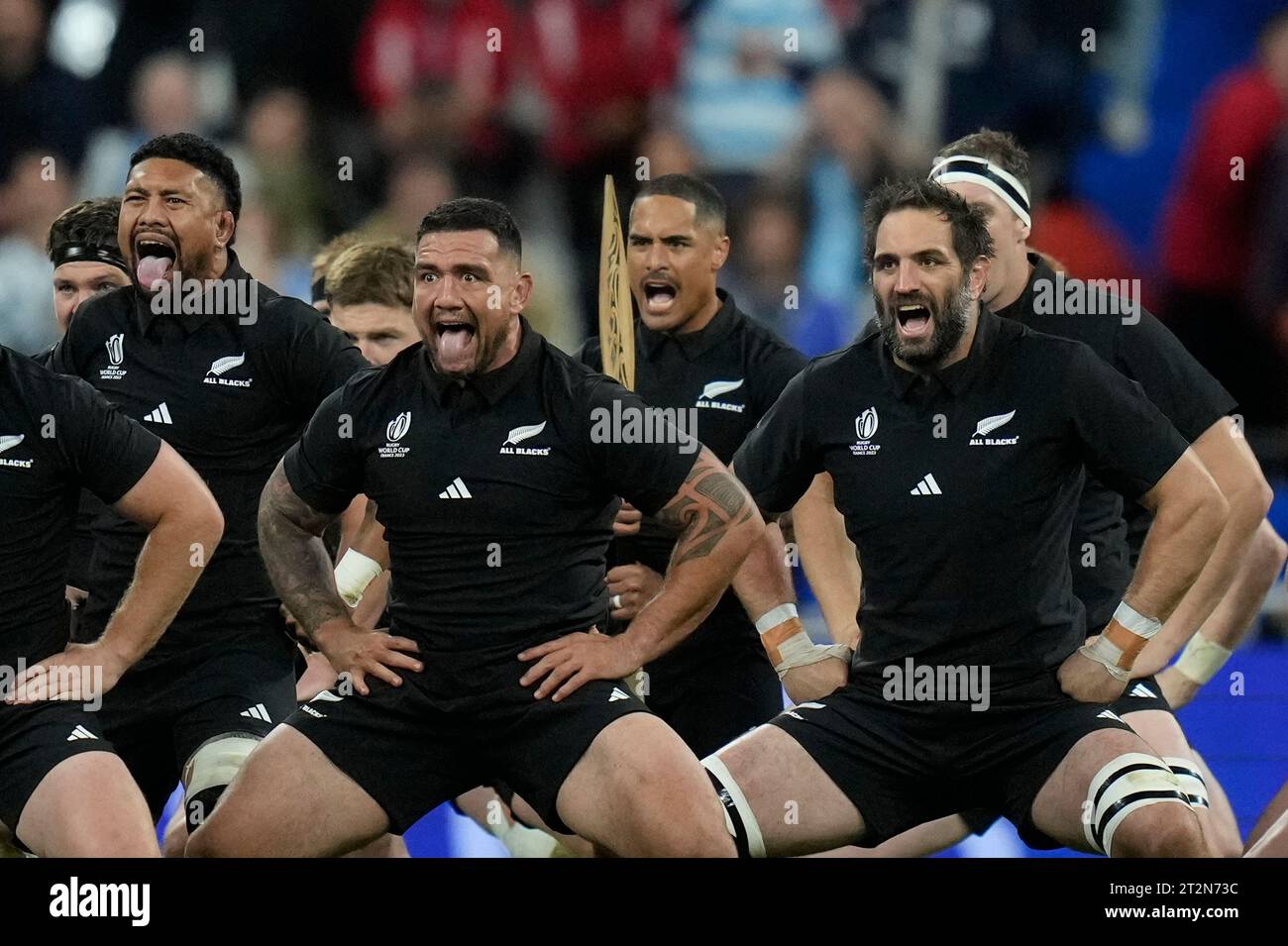 New Zealand's Aaron Smith, center, performs the Haka with teammates ...