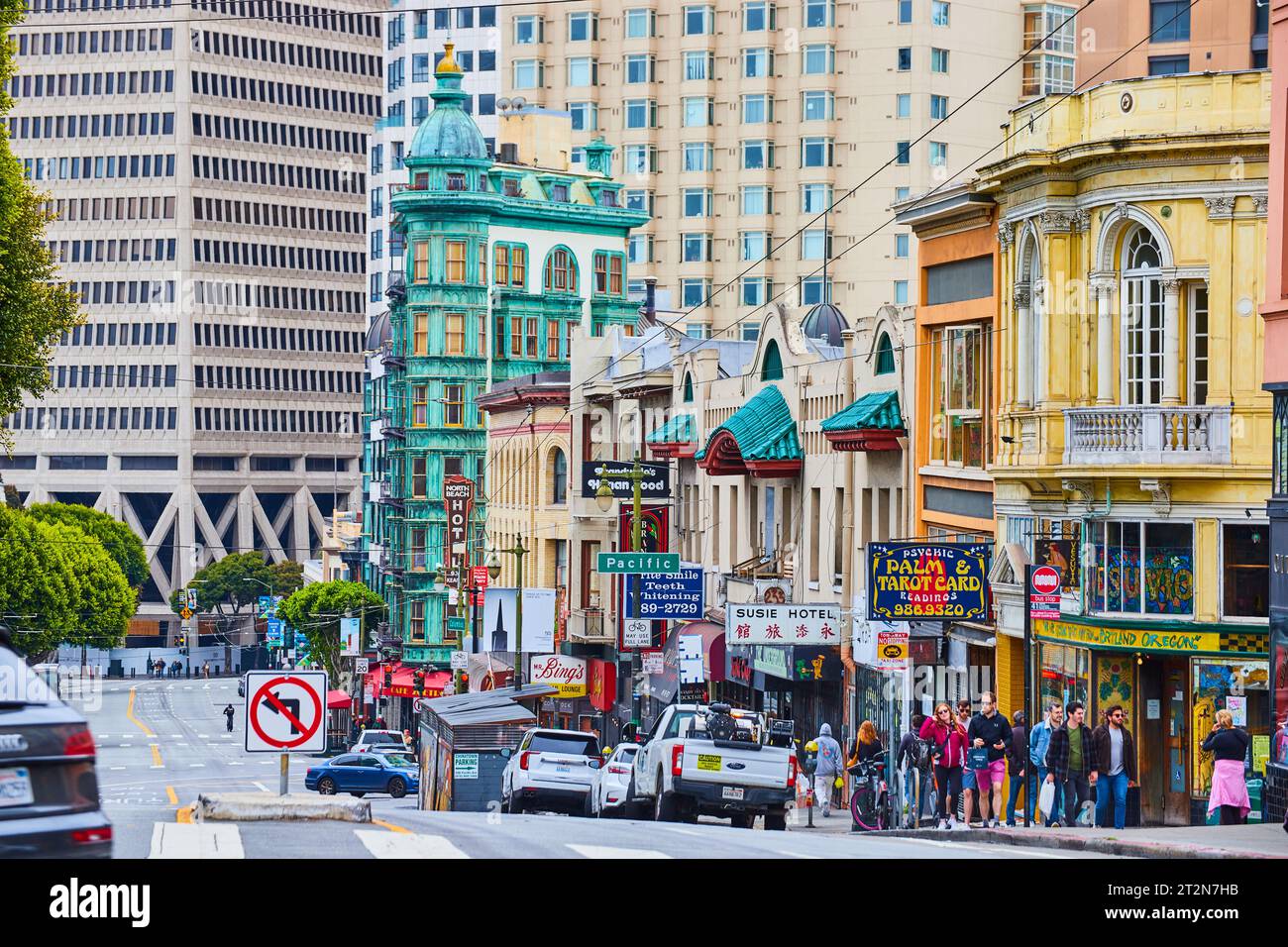 Street view of crowd wandering between shops in San Francisco inner ...
