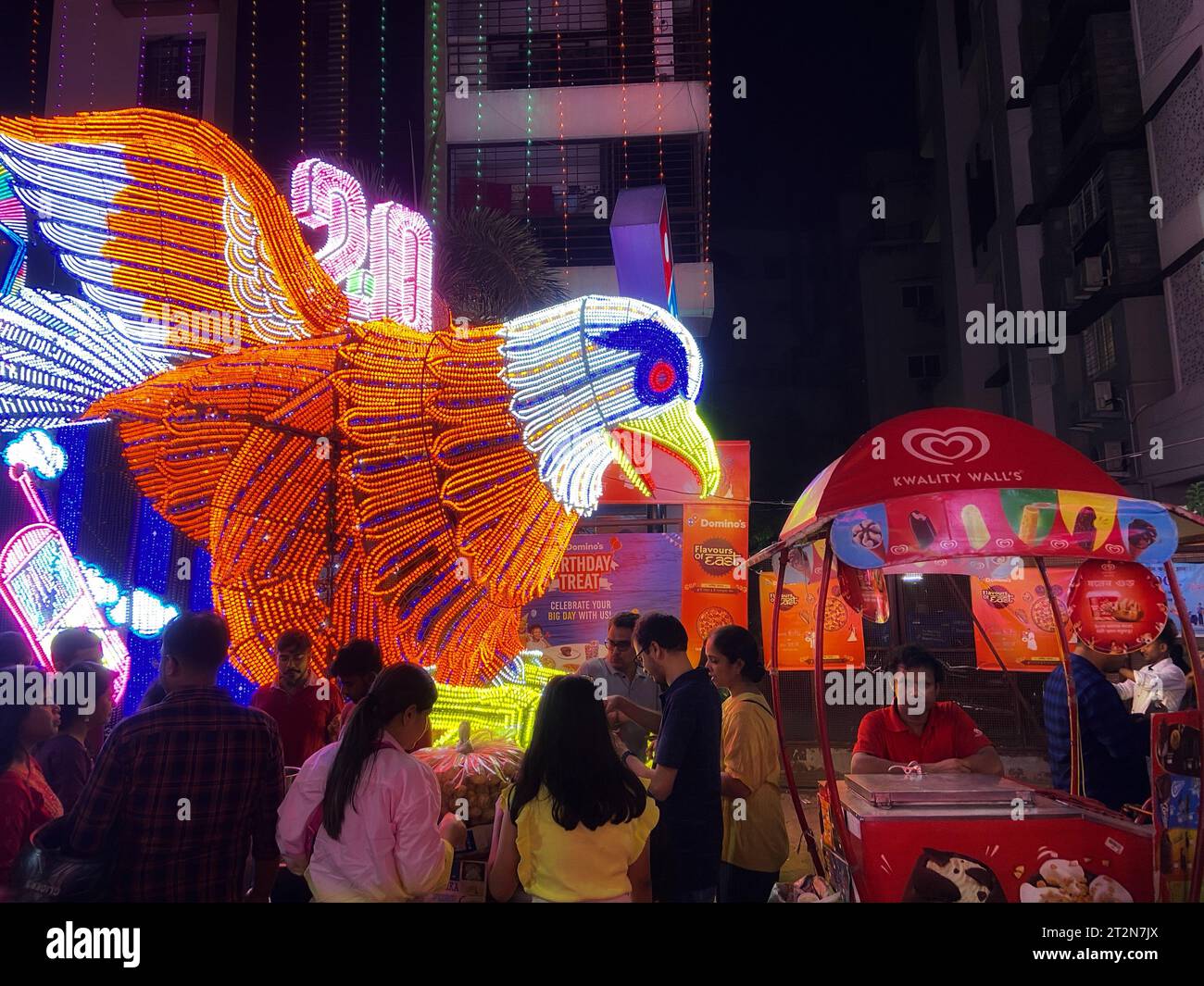 Visitors look at a lighting set up at the 'Hindustan Club' (Pandal ...