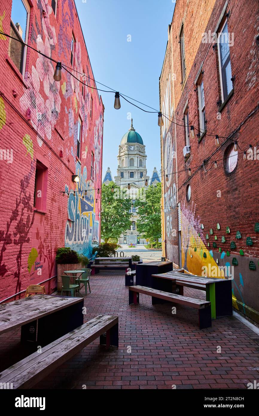 Alley with benches and chairs and wall art murals leading to Columbia ...