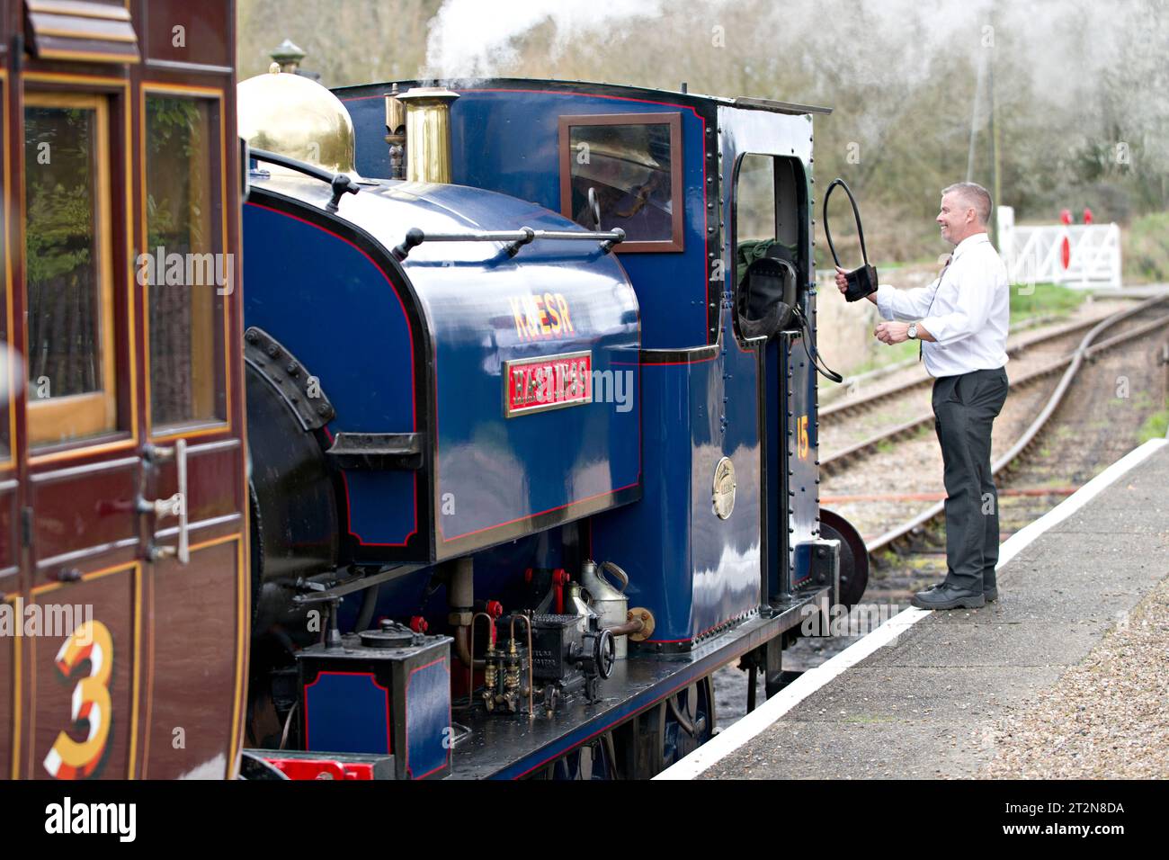 The signalman passes the single line token to the driver of a train at ...