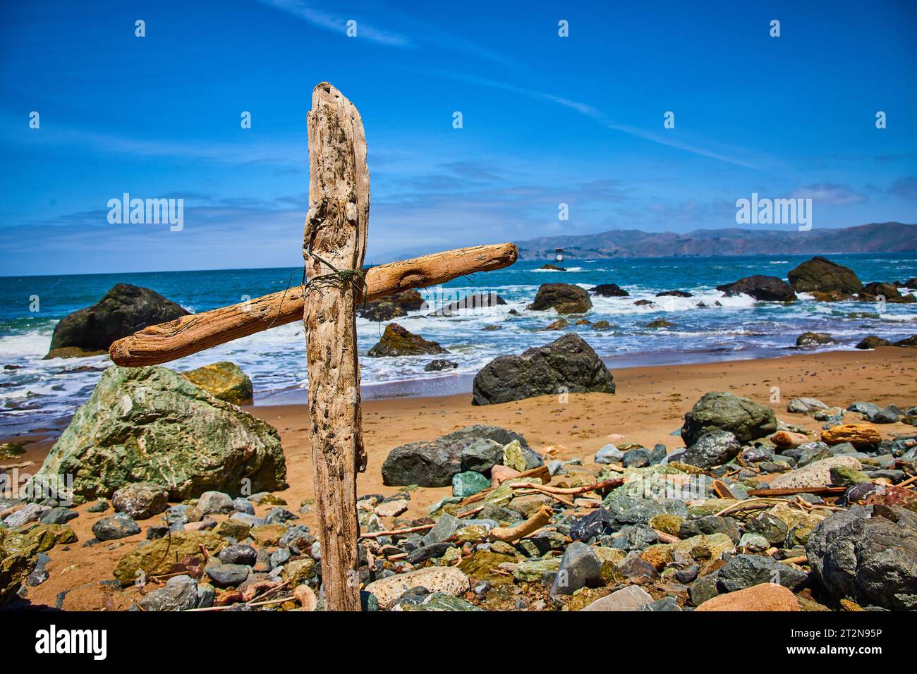 Inspiration and motivation in religious cross on shore with ocean waves ...