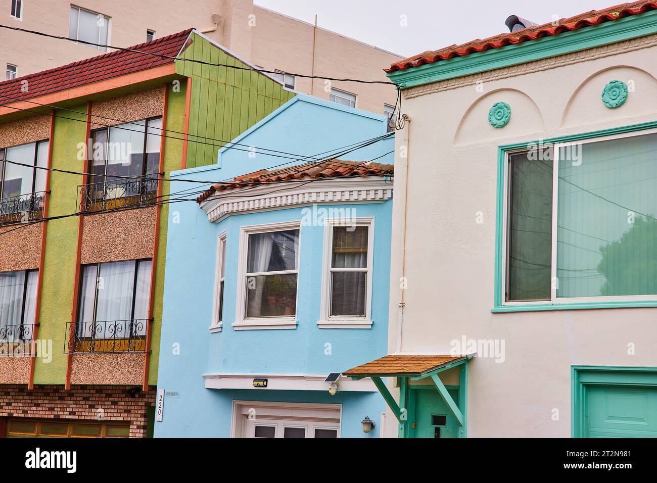 Three unique house styles side by side with varying colors in ...