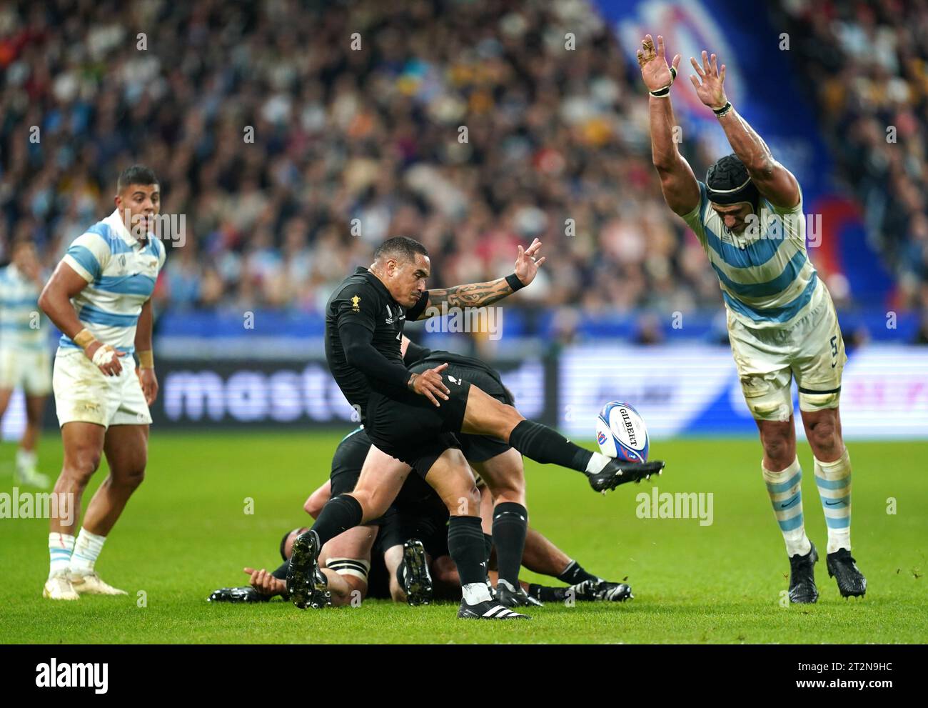 Argentina's Tomas Lavanini (right) charges down a box kick performed by ...