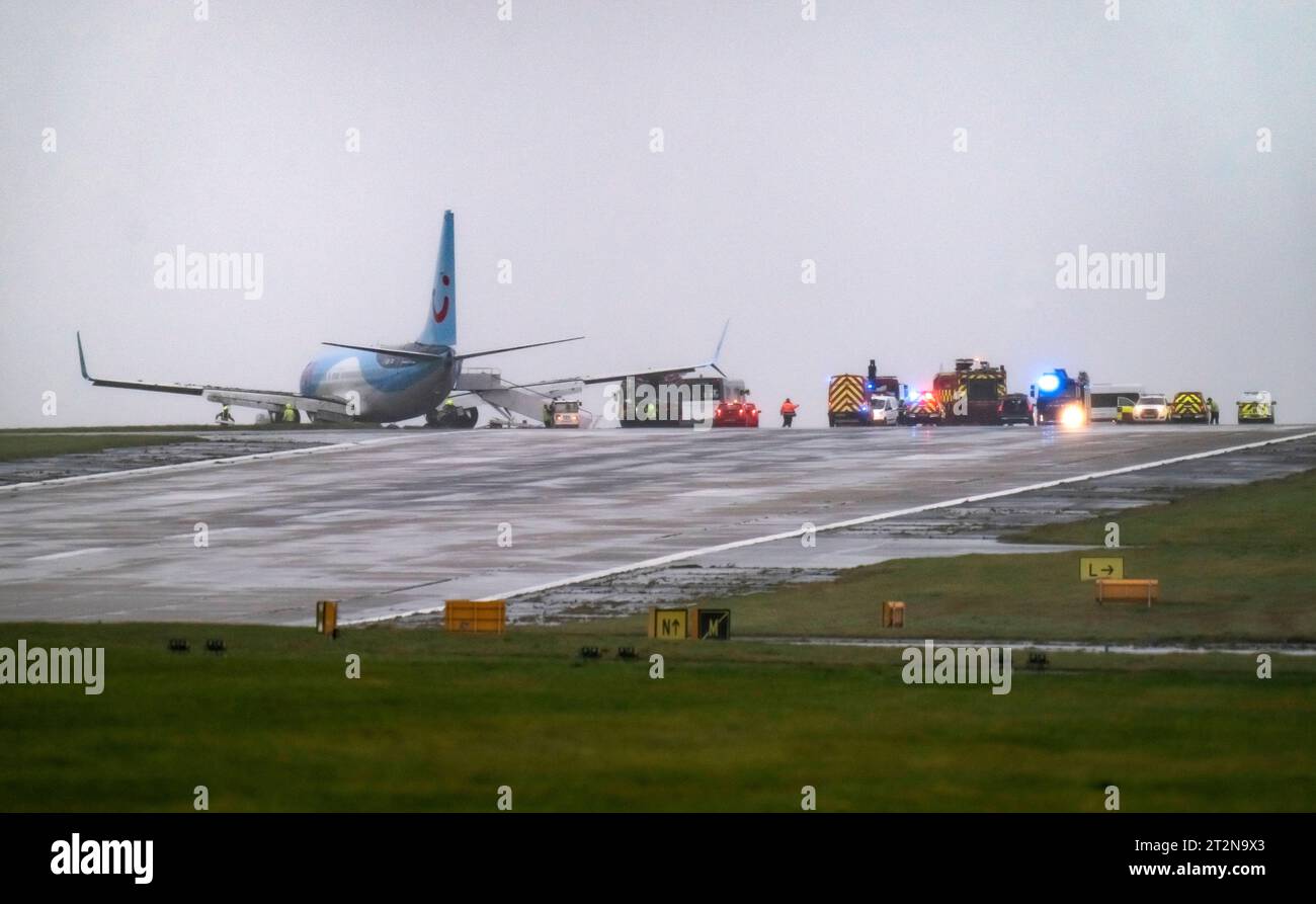 Emergency services at the scene after a passenger plane came off the ...