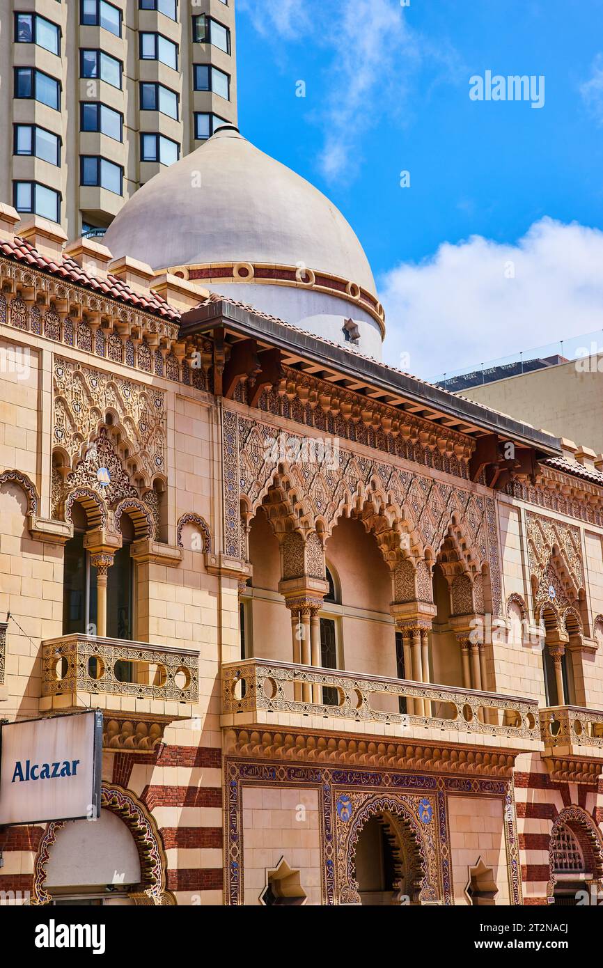 Alcazar building with unique architecture under bright blue sky with ...