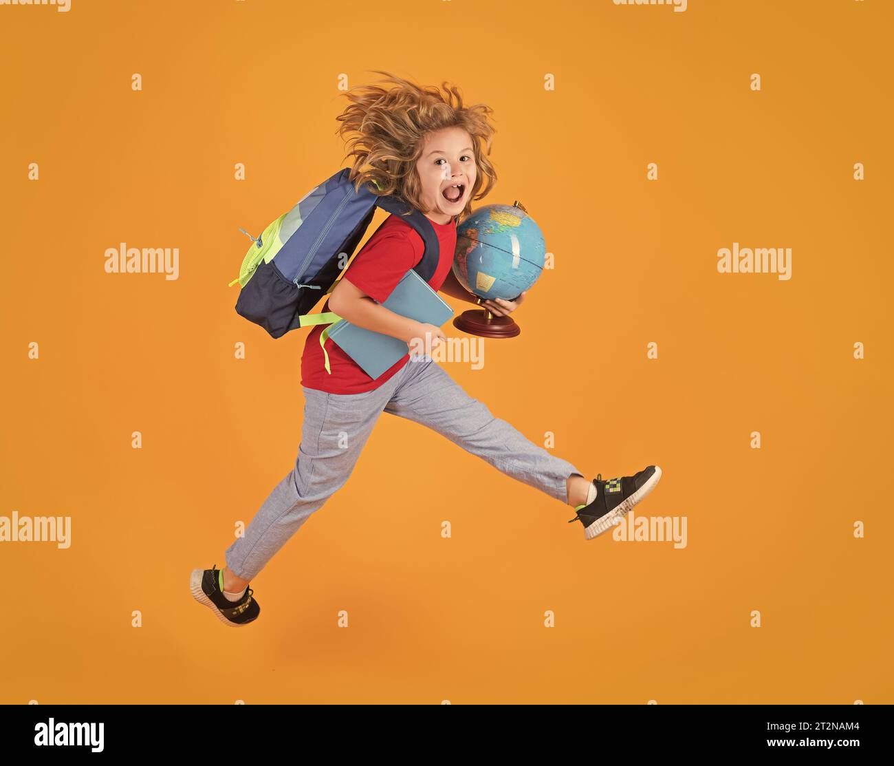 Shool kid jump with school bag and globe. Full length body of little ...