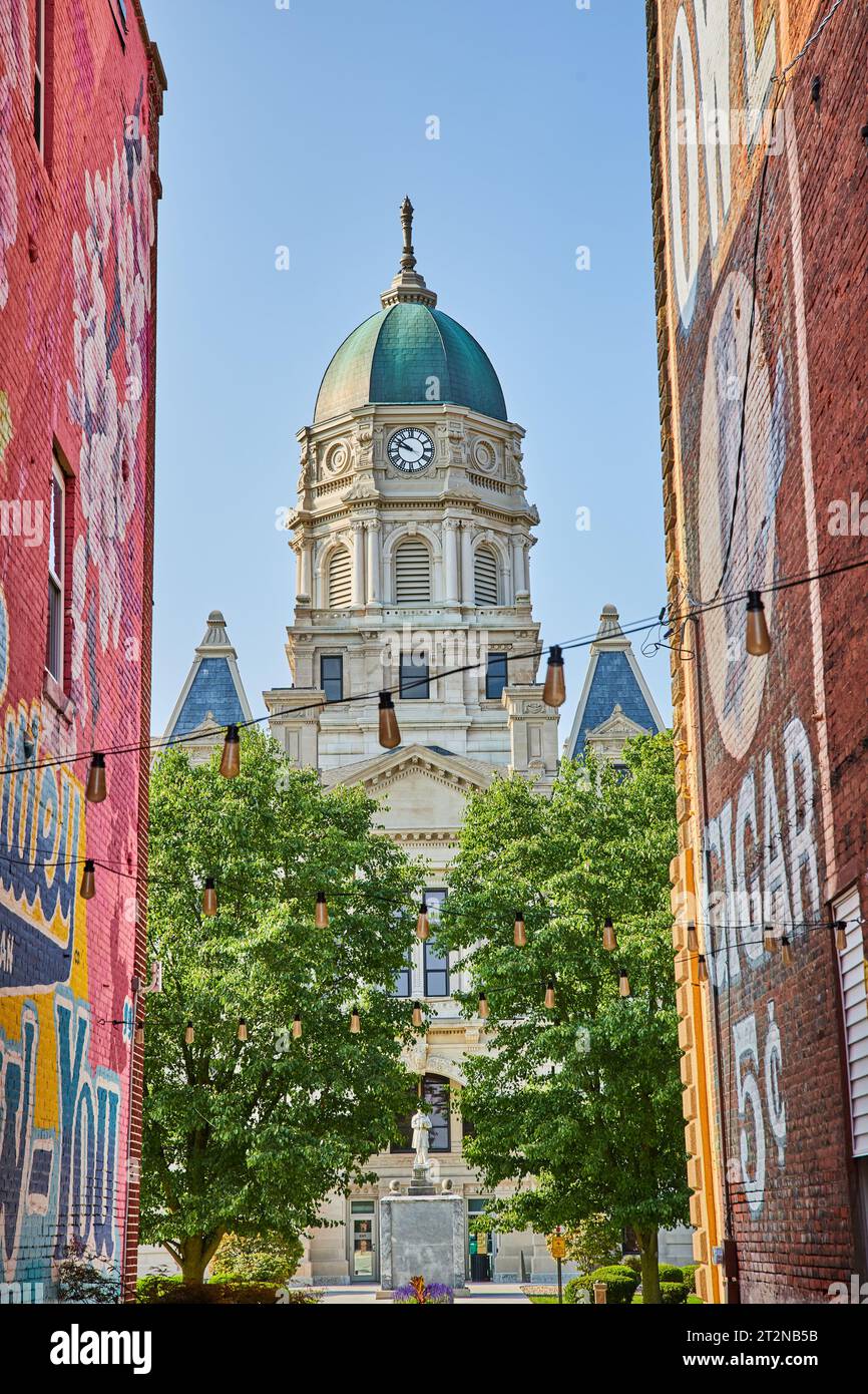 Wall murals on opposing building walls in alley with Columbia City ...