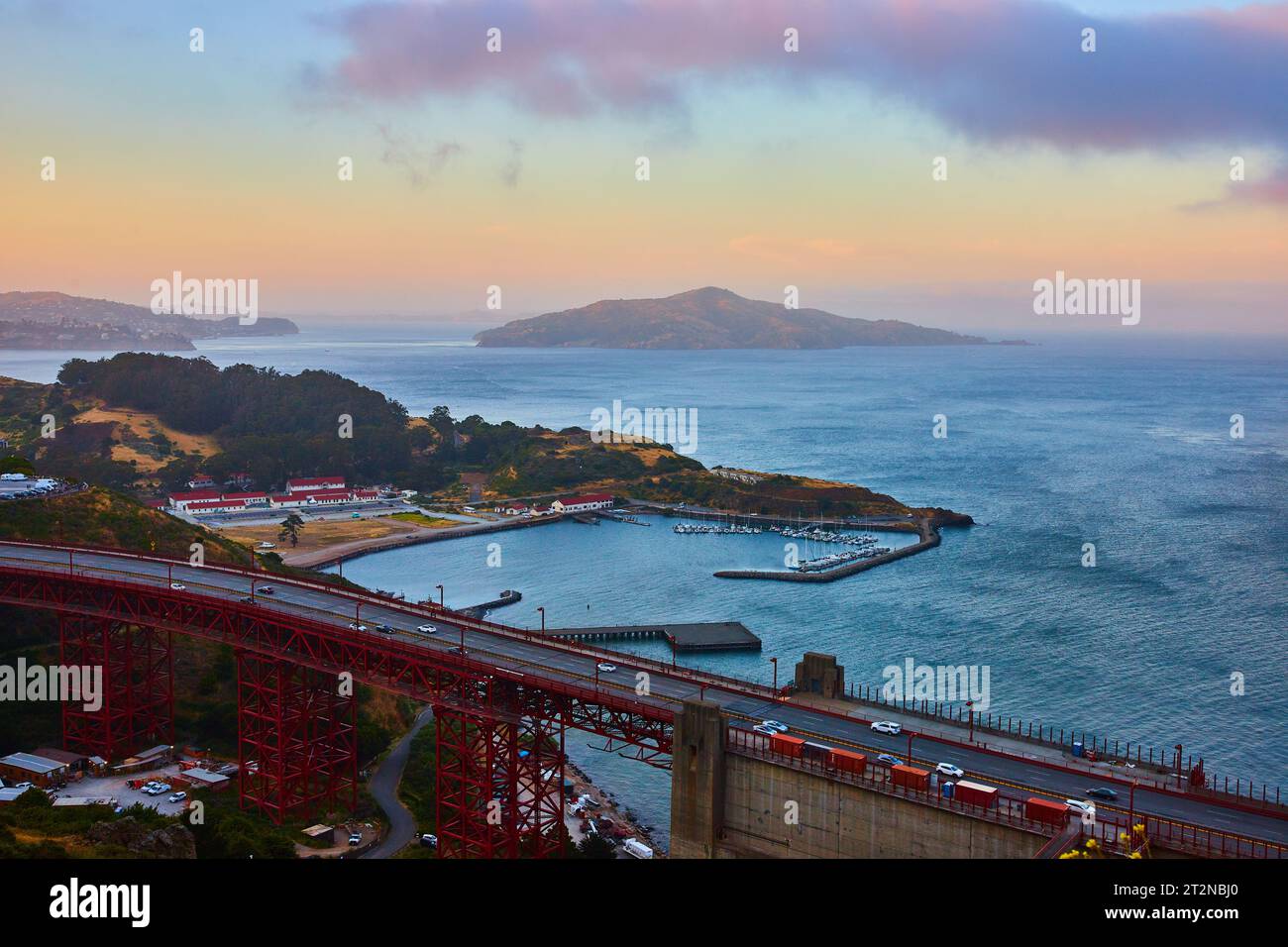 Gorgeous sunset clouds over Golden Gate Bridge overlook with distant ...
