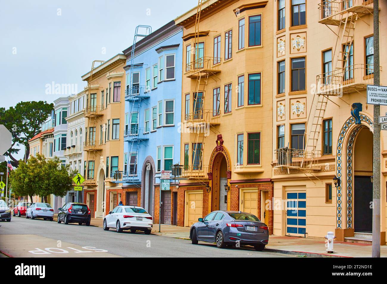 Tightly compact buildings with garages next to entry doors and fire ...
