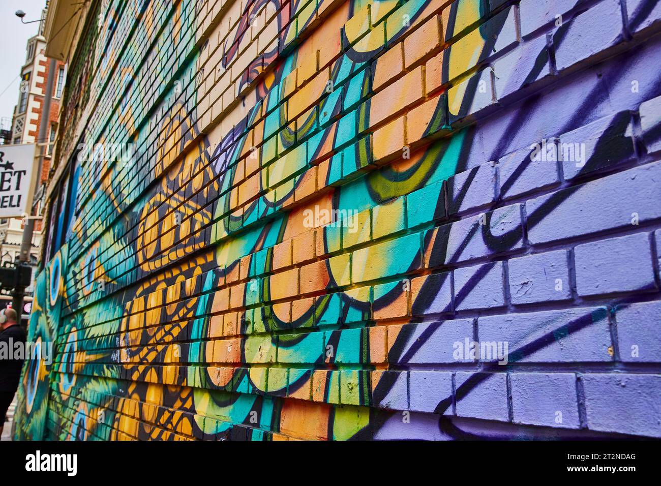 Variety of colors in massive side view of wall mural on brick wall in ...