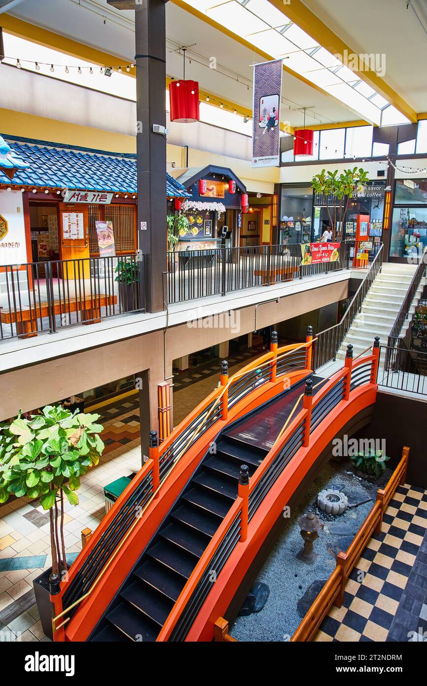 Curing orange and black bridge with steps and zen garden underneath ...