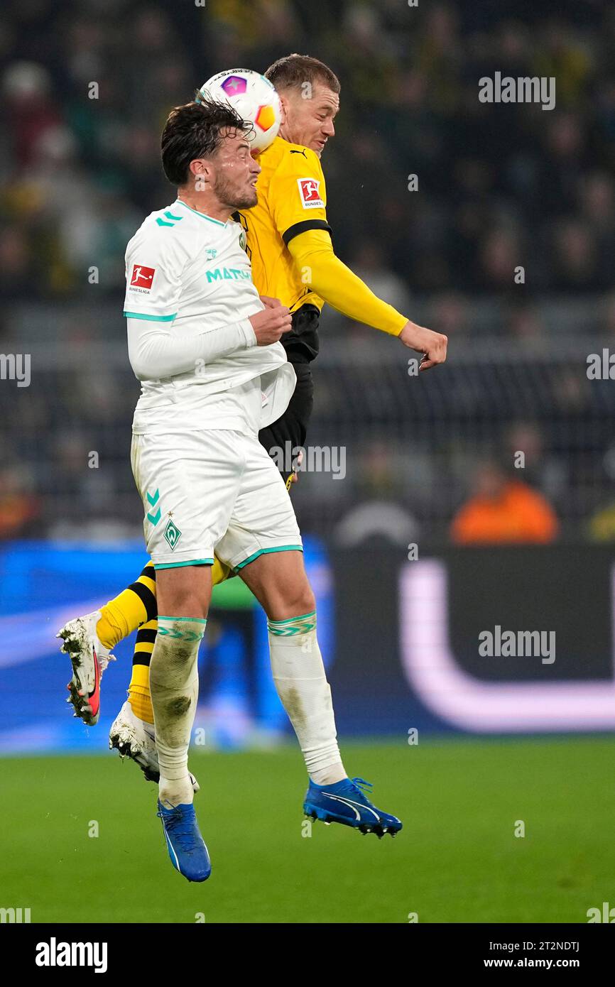 Dortmund's Julian Ryerson goes up against Bremen's Olivier Deman during ...