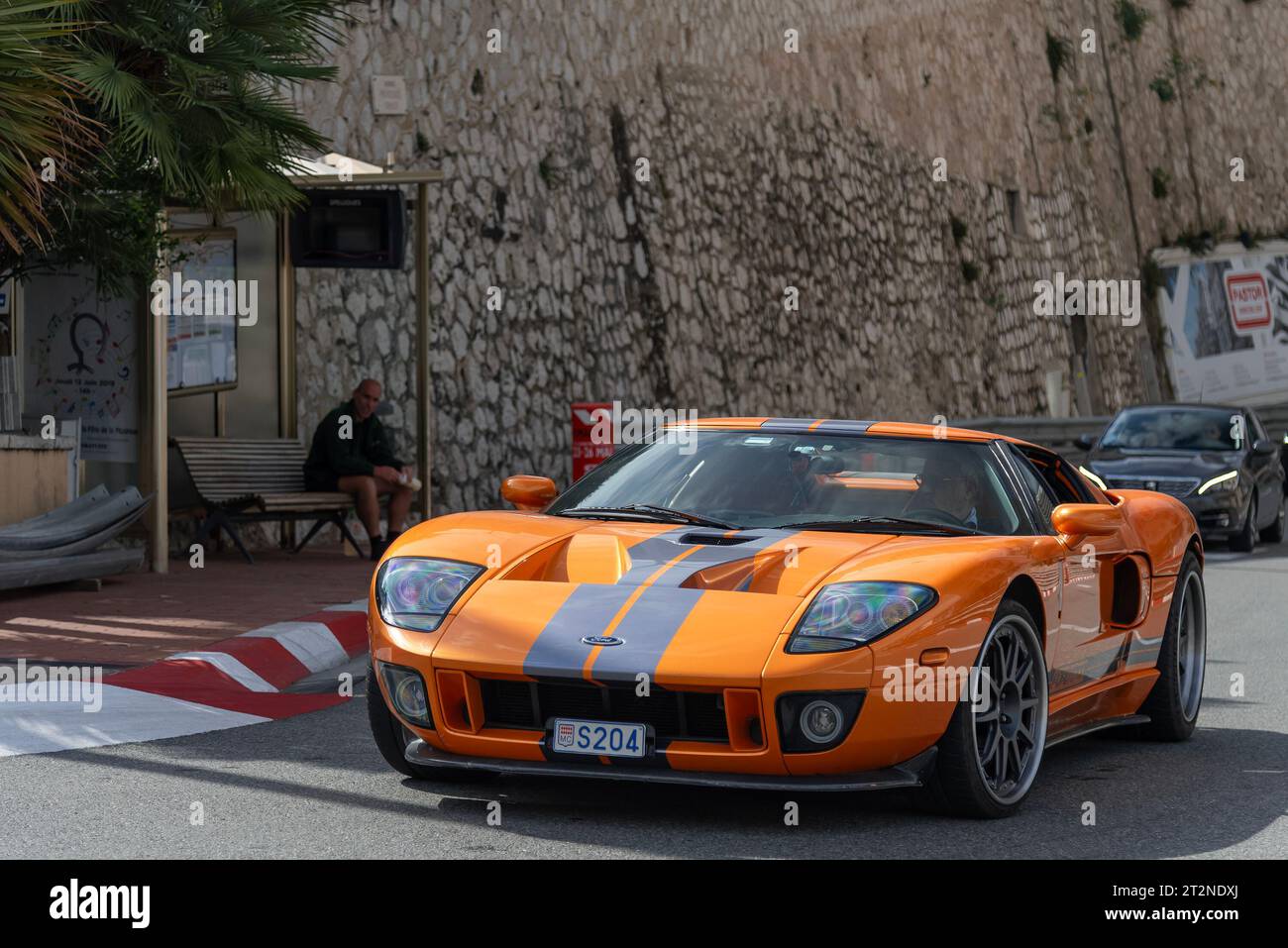 Orange Ford GTX1 driving on the road Stock Photo - Alamy