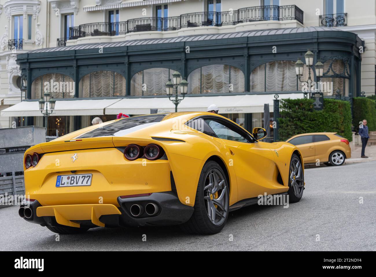 Yellow Ferrari 812 Superfast driving on the road Stock Photo - Alamy