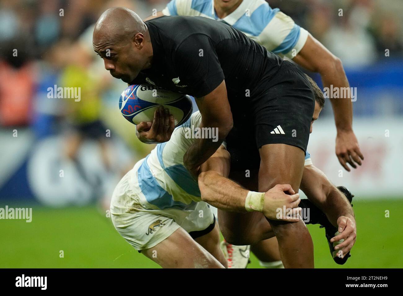 New Zealand's Mark Telea is tackled during the Rugby World Cup ...
