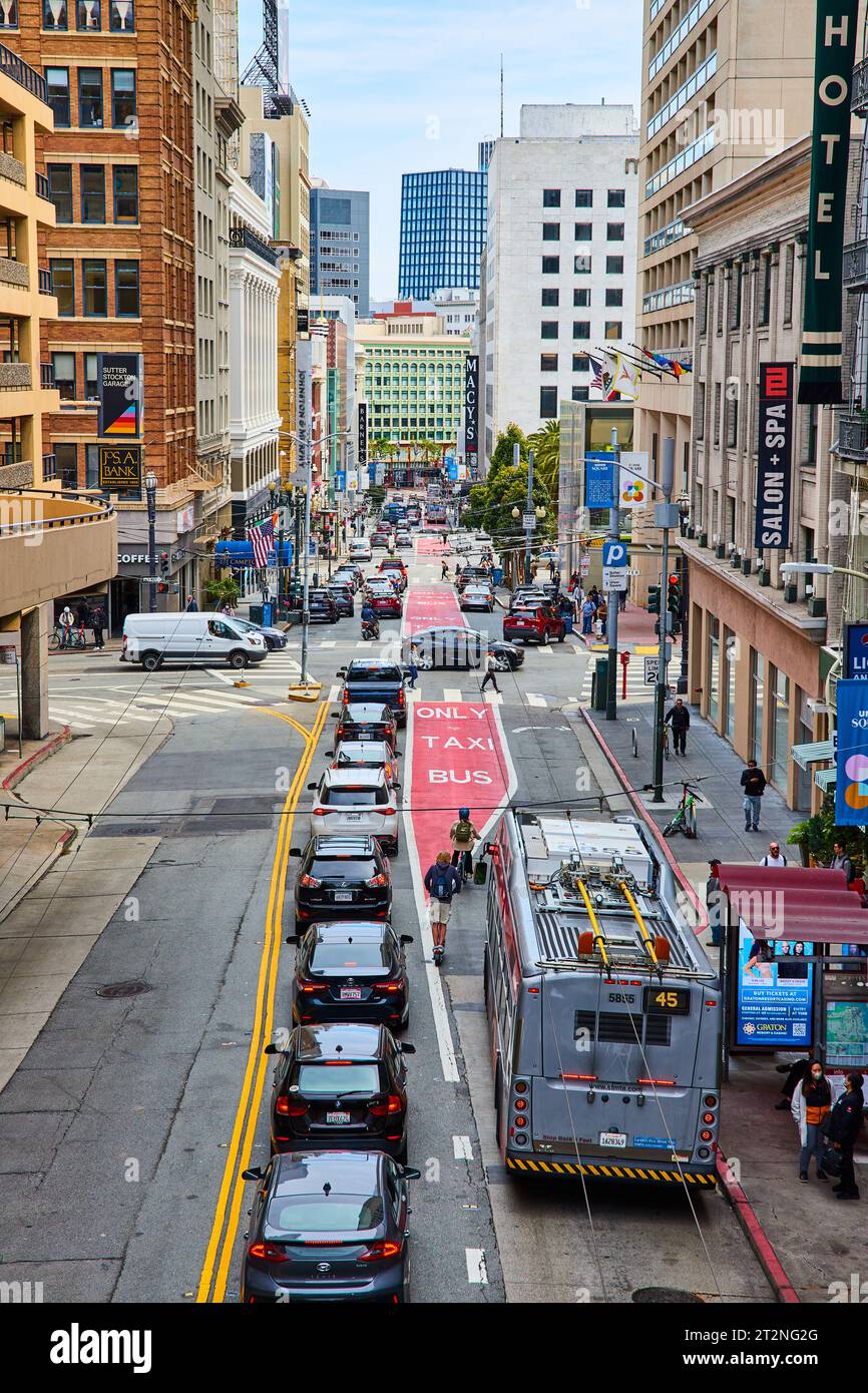 Row of cars at stoplight with clean air vehicle in bus only lane and ...