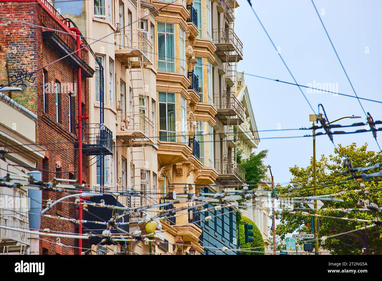 Row of houses with jutting out bay windows and escape ladders with ...
