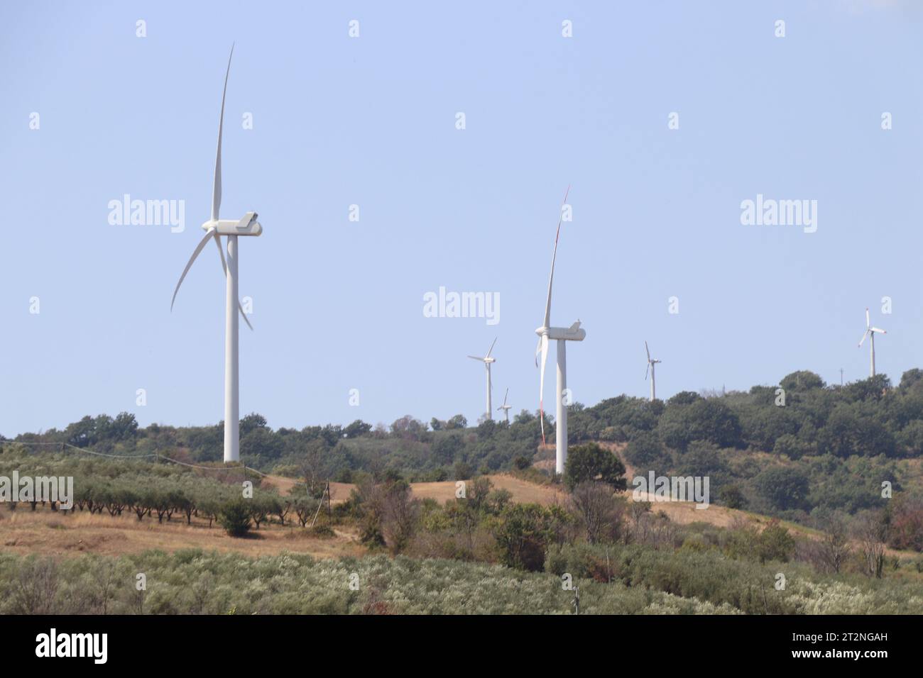 A row of wind turbines generating green energy Stock Photo - Alamy