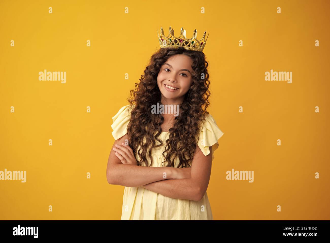 Little queen wearing golden crown. Teenage girl princess holding crown ...