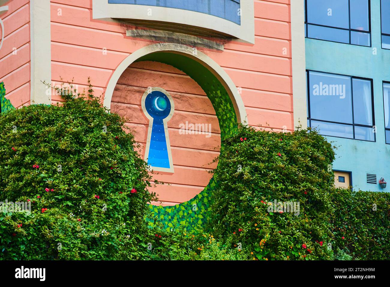 Abstract colorful magical keyhole in side of building surrounded by ...