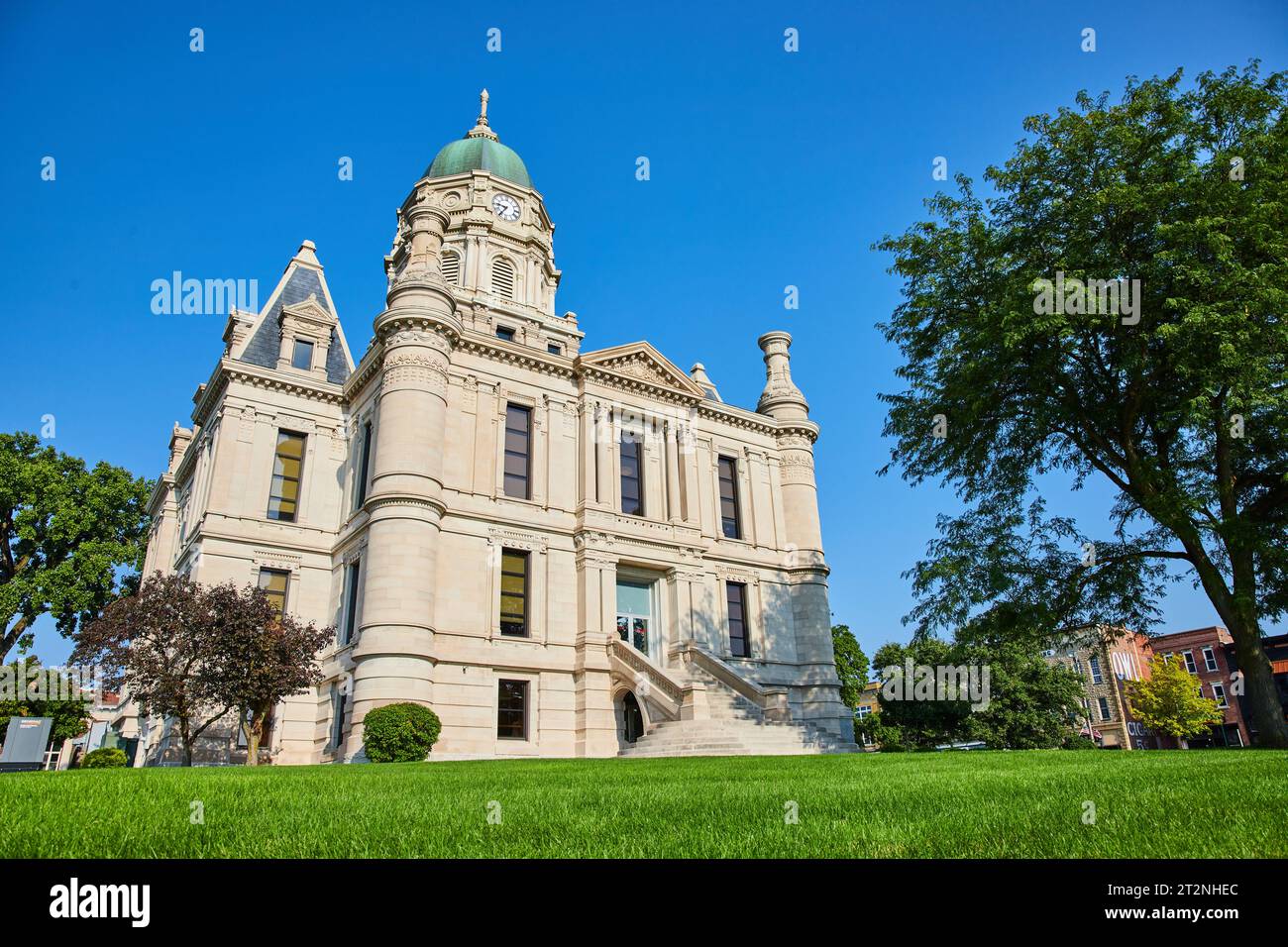 Green lawn and blue sky day with front view of Whitley County ...