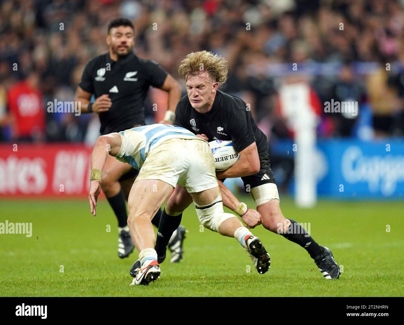 New Zealand's Damian McKenzie (right) tackled by Argentina's Mateo ...