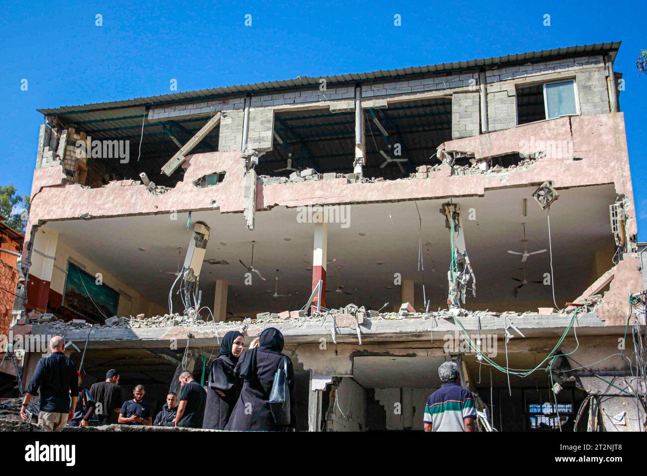 People look at destruction after an Israeli army raid on a Palestinian ...